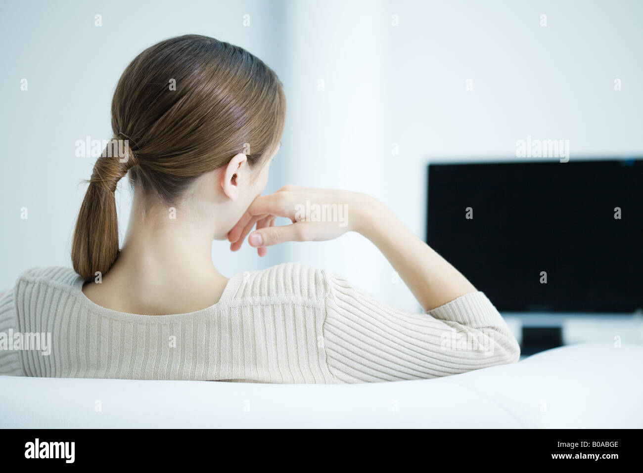 Rear view young woman watching hi-res stock photography and images - Alamy