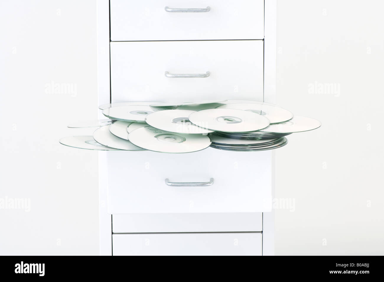 CDs spilling out of filing cabinet drawer Stock Photo - Alamy