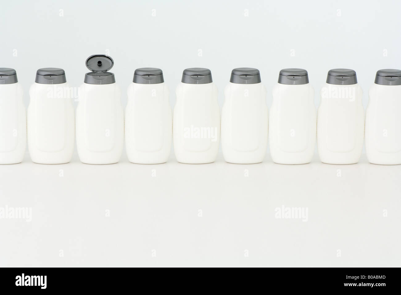 Line of bottles, one open Stock Photo - Alamy