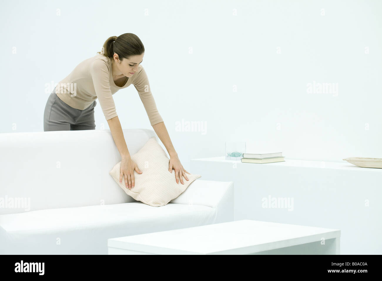 Lean over table hi-res stock photography and images - Alamy