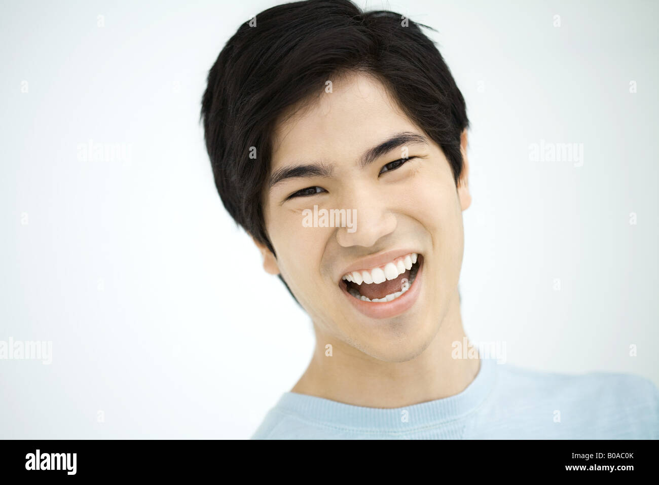 Young man laughing, portrait Stock Photo - Alamy