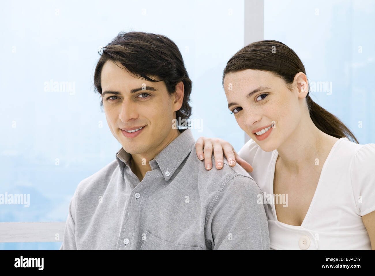 Couple smiling at camera, portrait Stock Photo - Alamy