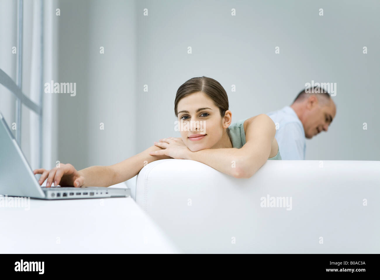Man leaning against couch hi-res stock photography and images - Alamy
