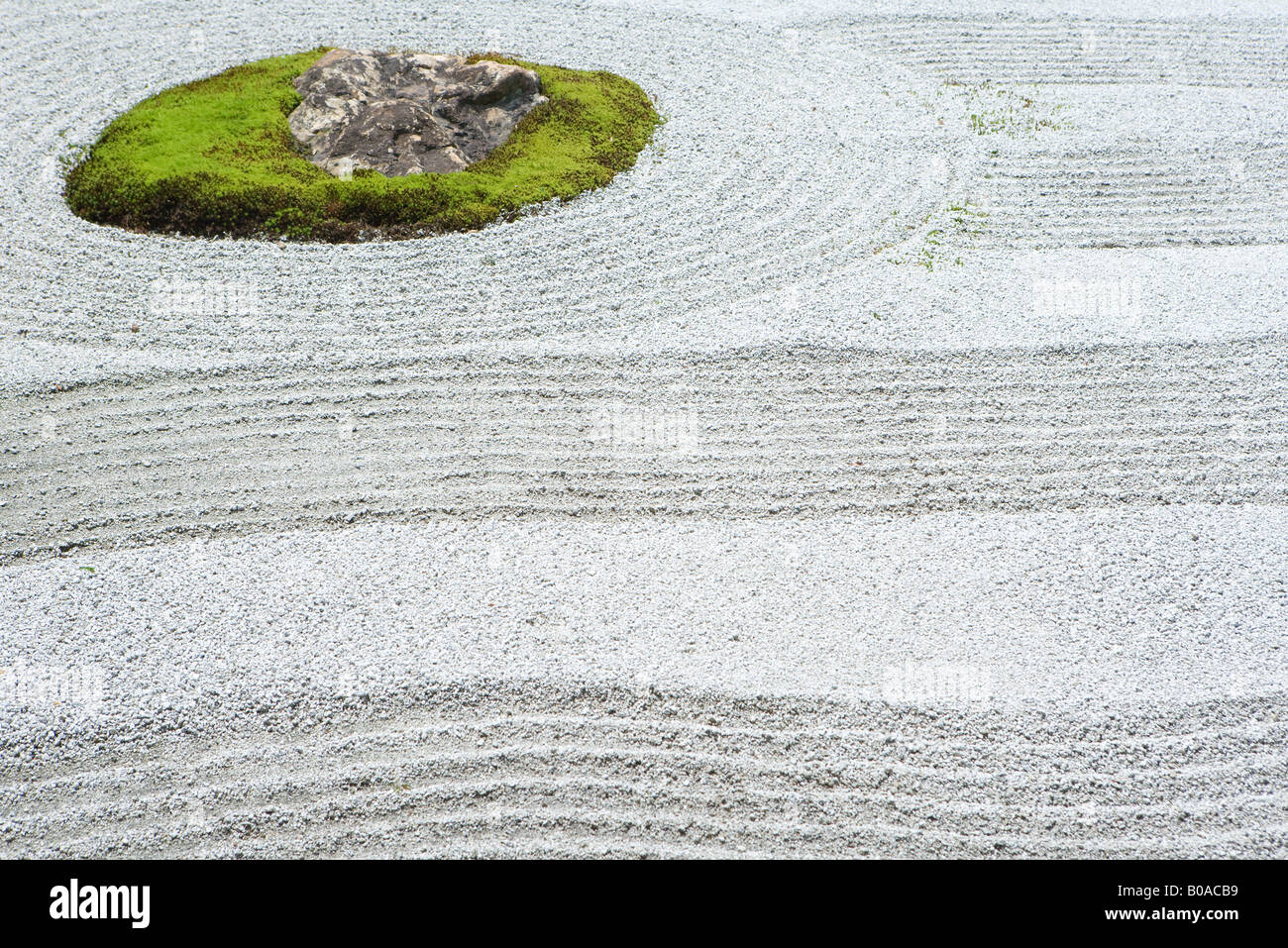 Raked patterns in rock garden Stock Photo - Alamy