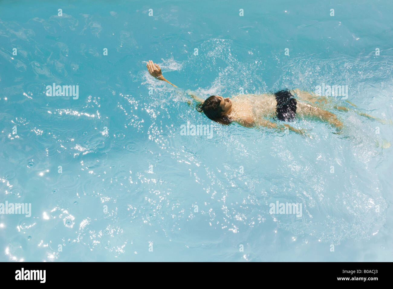 Man swimming backstroke in pool, high angle view Stock Photo - Alamy