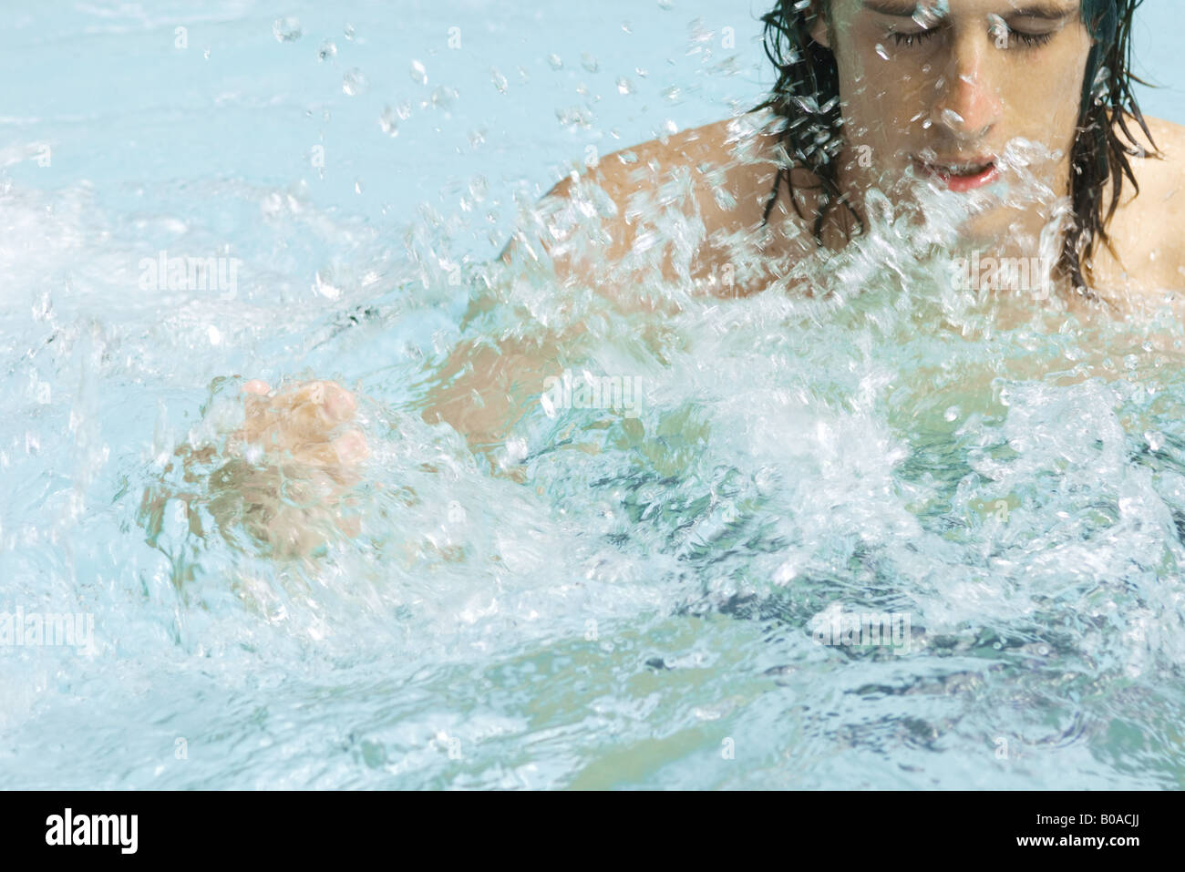Man splashing in swimming pool, close-up Stock Photo - Alamy
