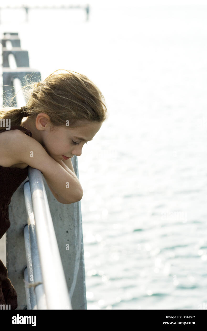 Child leaning over railing hi-res stock photography and images - Alamy