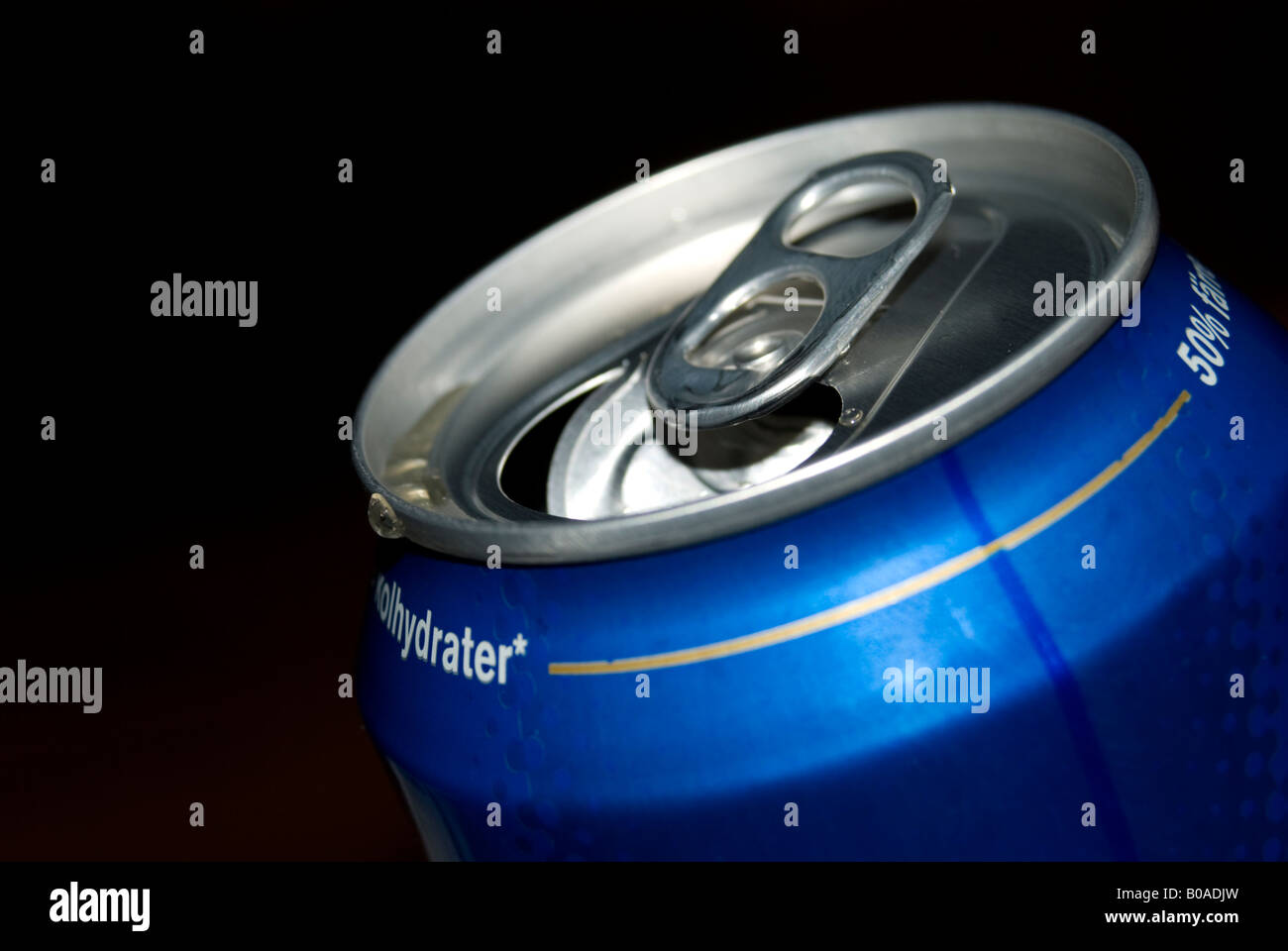 Top of opened blue can with drop of beer shot with flash Stock Photo ...