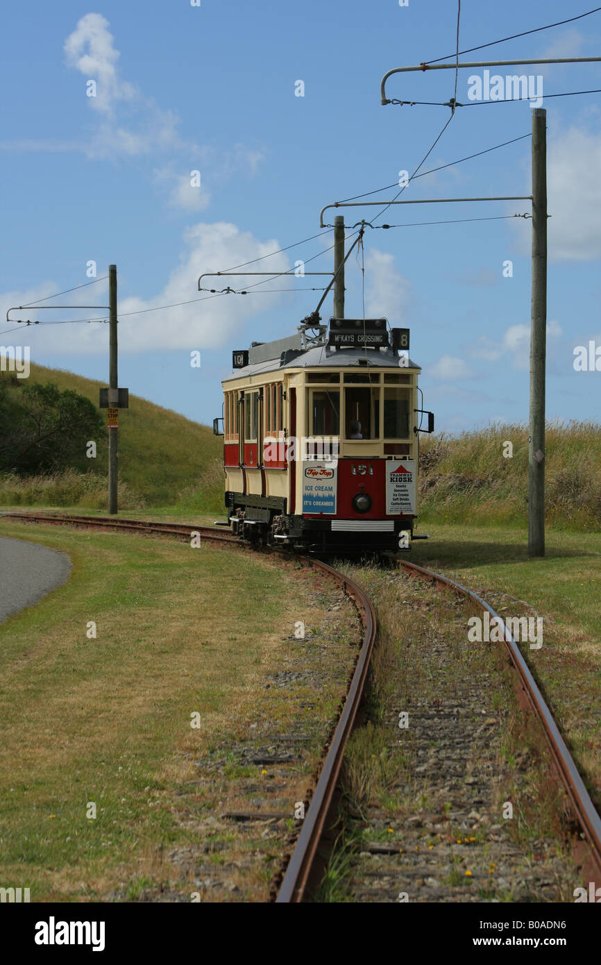 Electric tram travelling along rail tracks Stock Photo - Alamy
