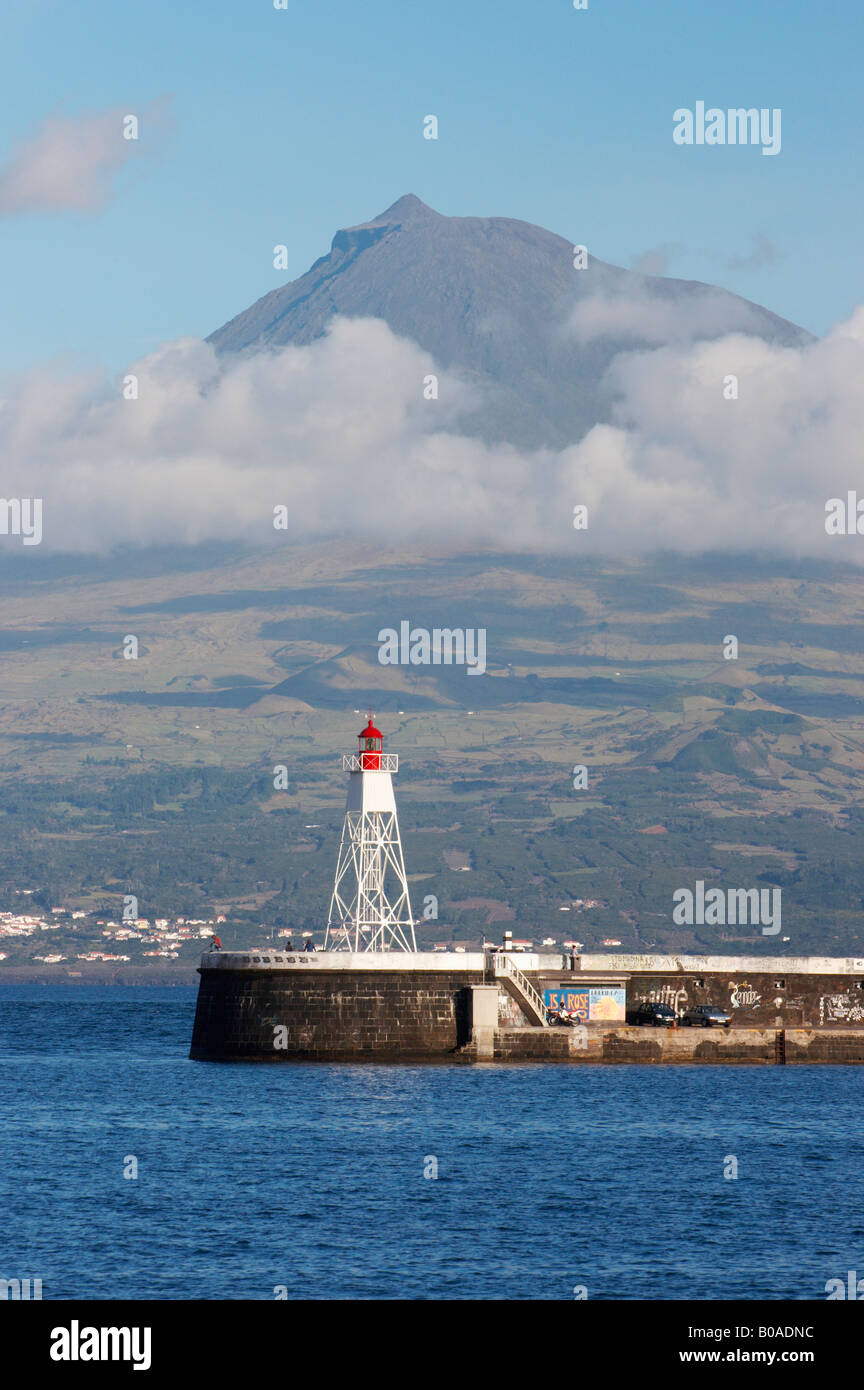Horta lighthouse on Faial island in The Azores with Pico island in the ...