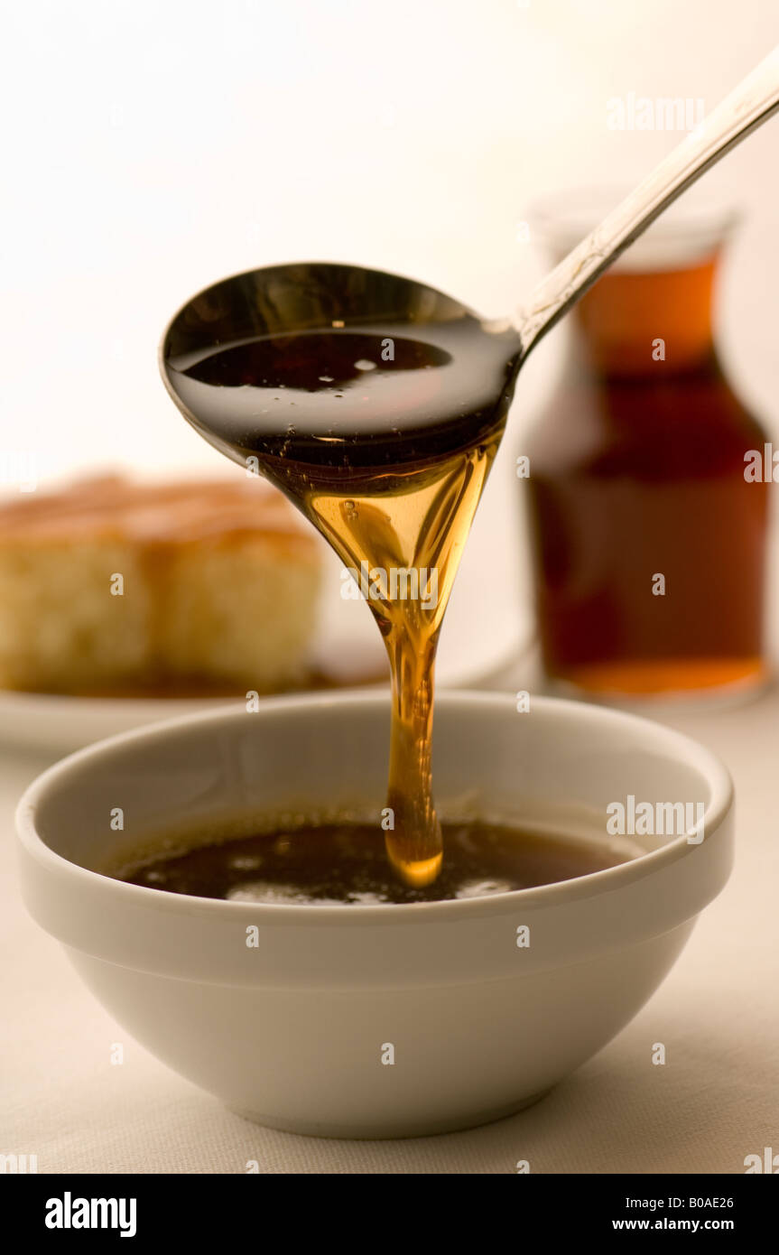 Syrup pouring from a ladle Stock Photo - Alamy