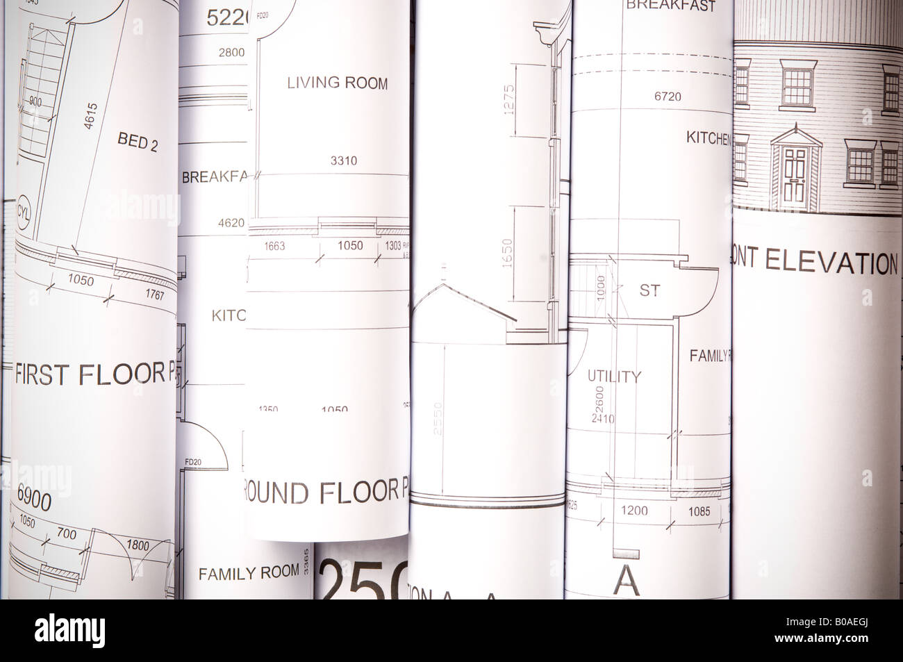 Closeup of rolled up paper copies of architectural floor plans for a ...