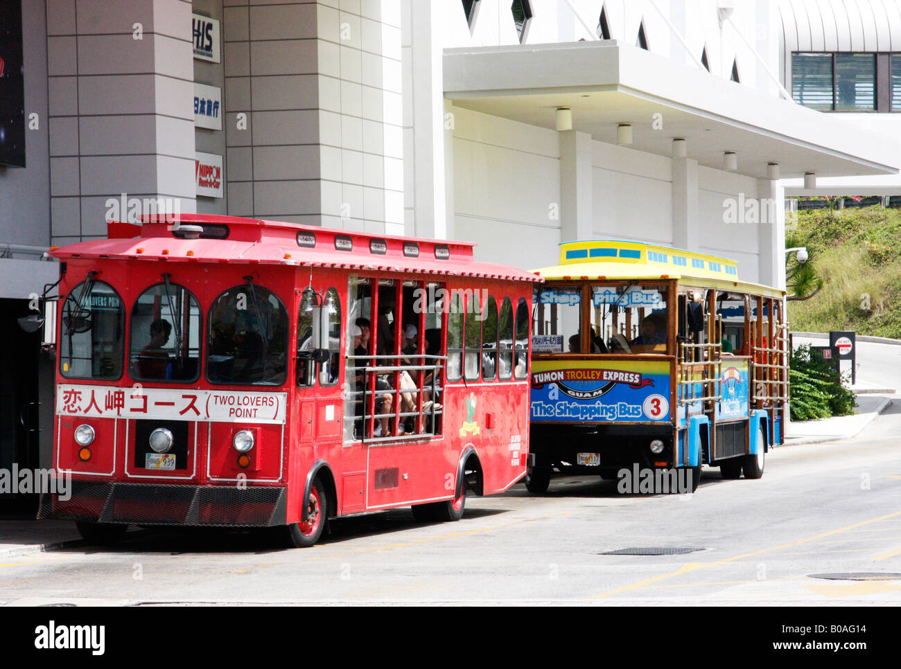 Colorful trolley buses outside Galleria shopping Mall in Tumon on Guam ...