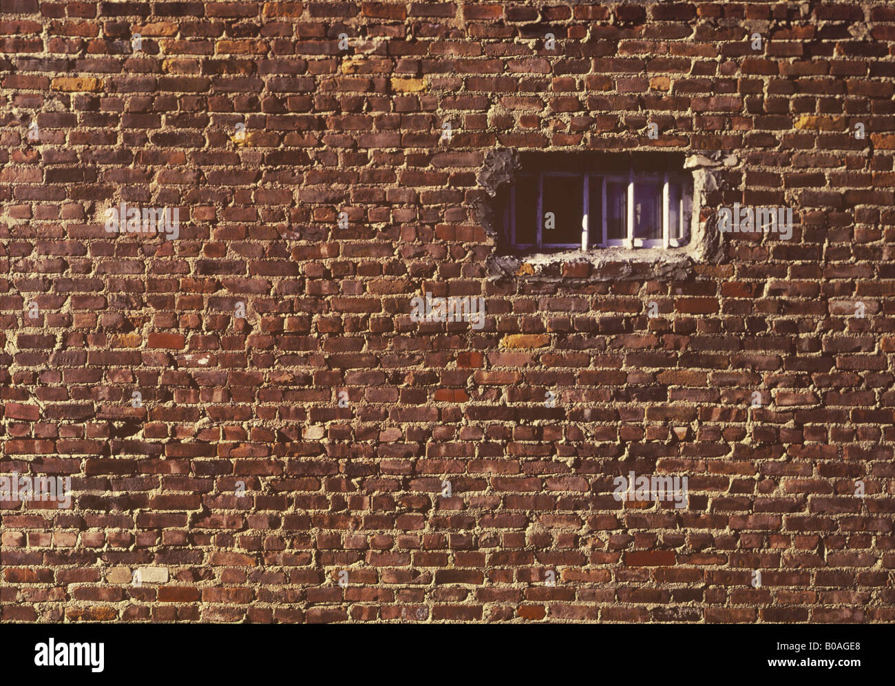 brick wall with small window Stock Photo - Alamy