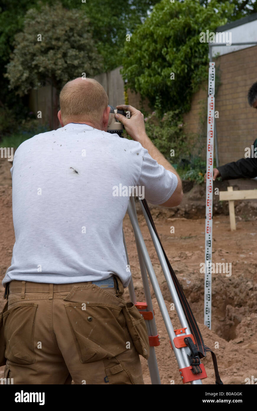 Checking levels on building site Stock Photo - Alamy
