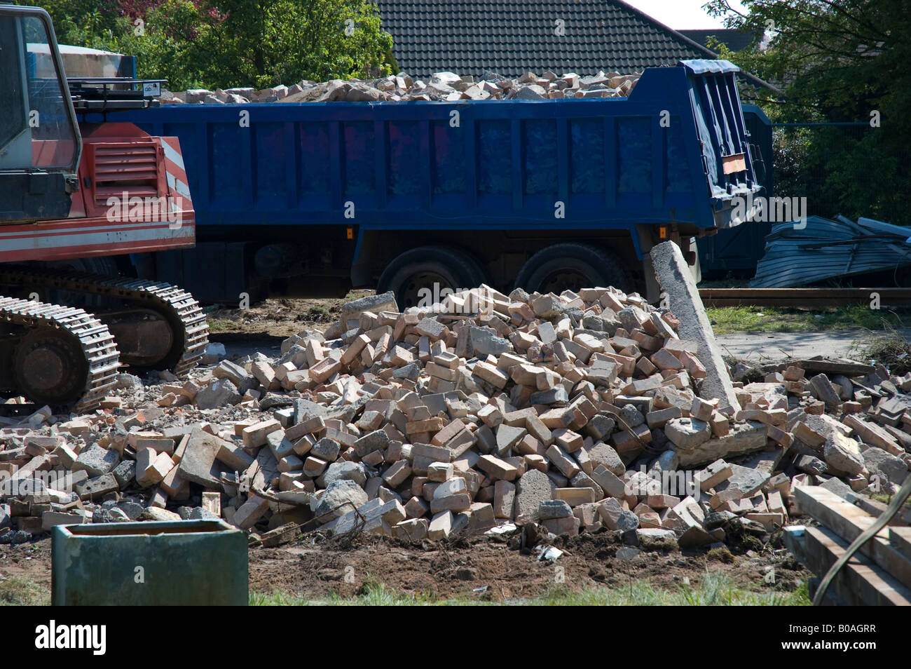 Pile of bricks and lorry at demolition site Stock Photo - Alamy
