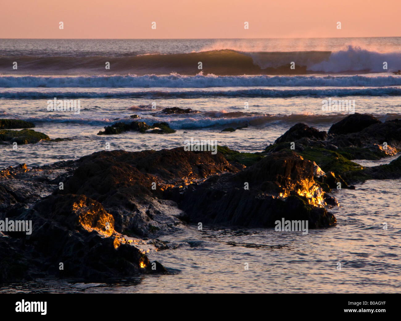 Waves crashing as the sun sets on Croyd beach North Devon UK Stock ...