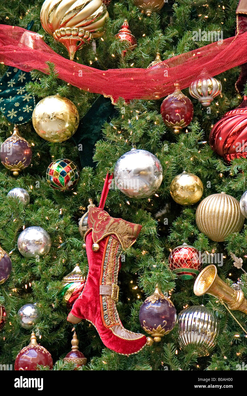 A decorated Christmas tree with balls ribbons and an elf boot Stock ...
