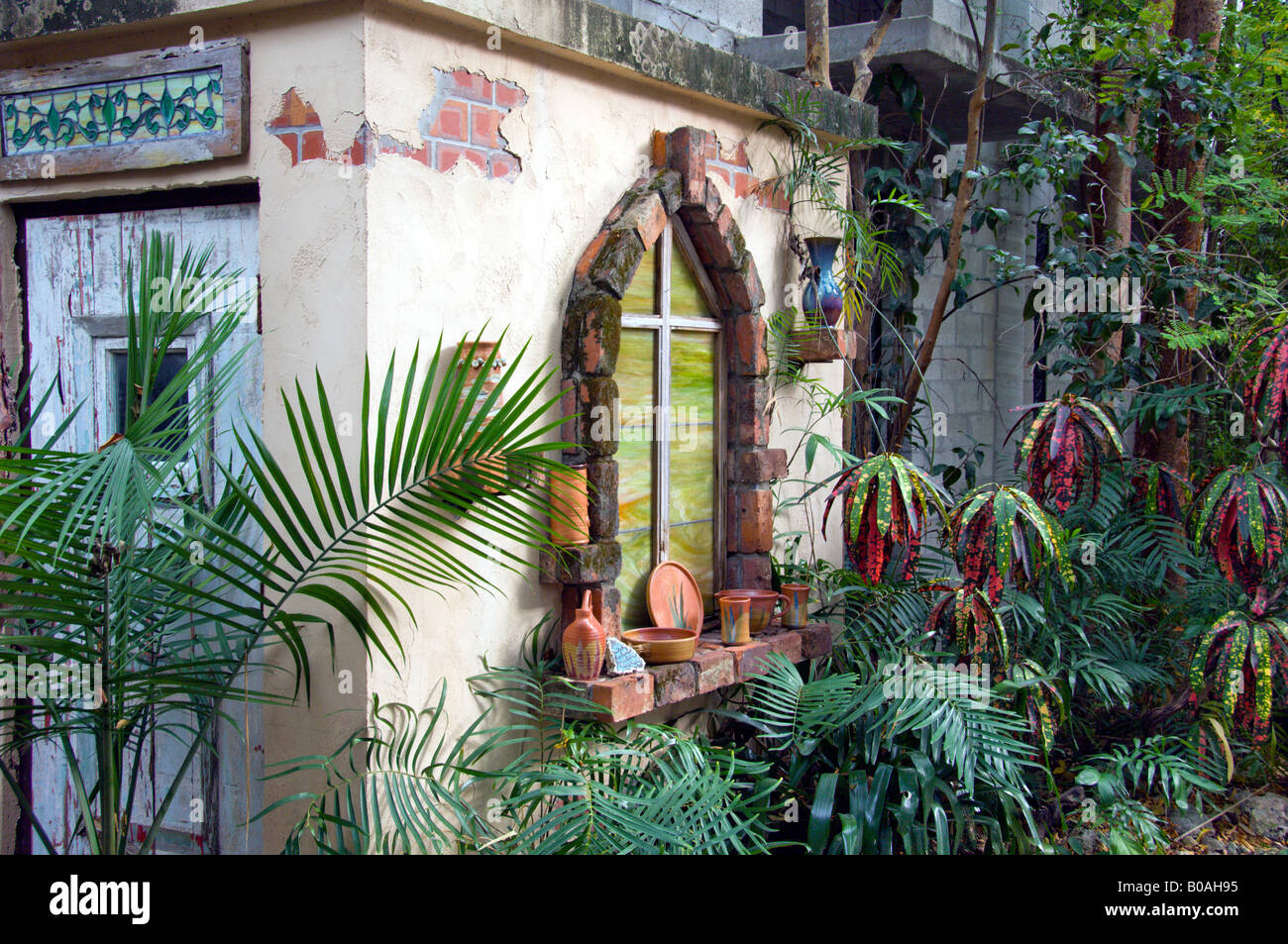Decorative tropical foliage and a rustic window display in the Florida ...