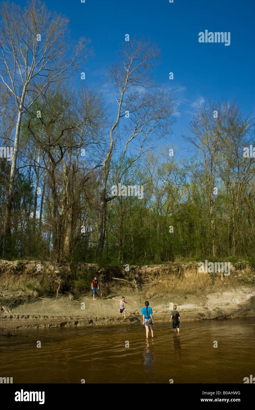 Four children playing in the Strong River Stock Photo - Alamy