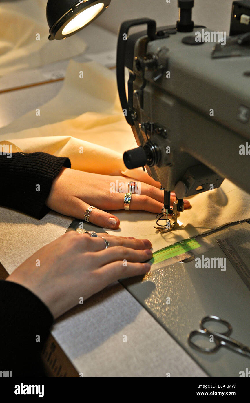 A dressmaker sewing on a sewing-machine Stock Photo - Alamy