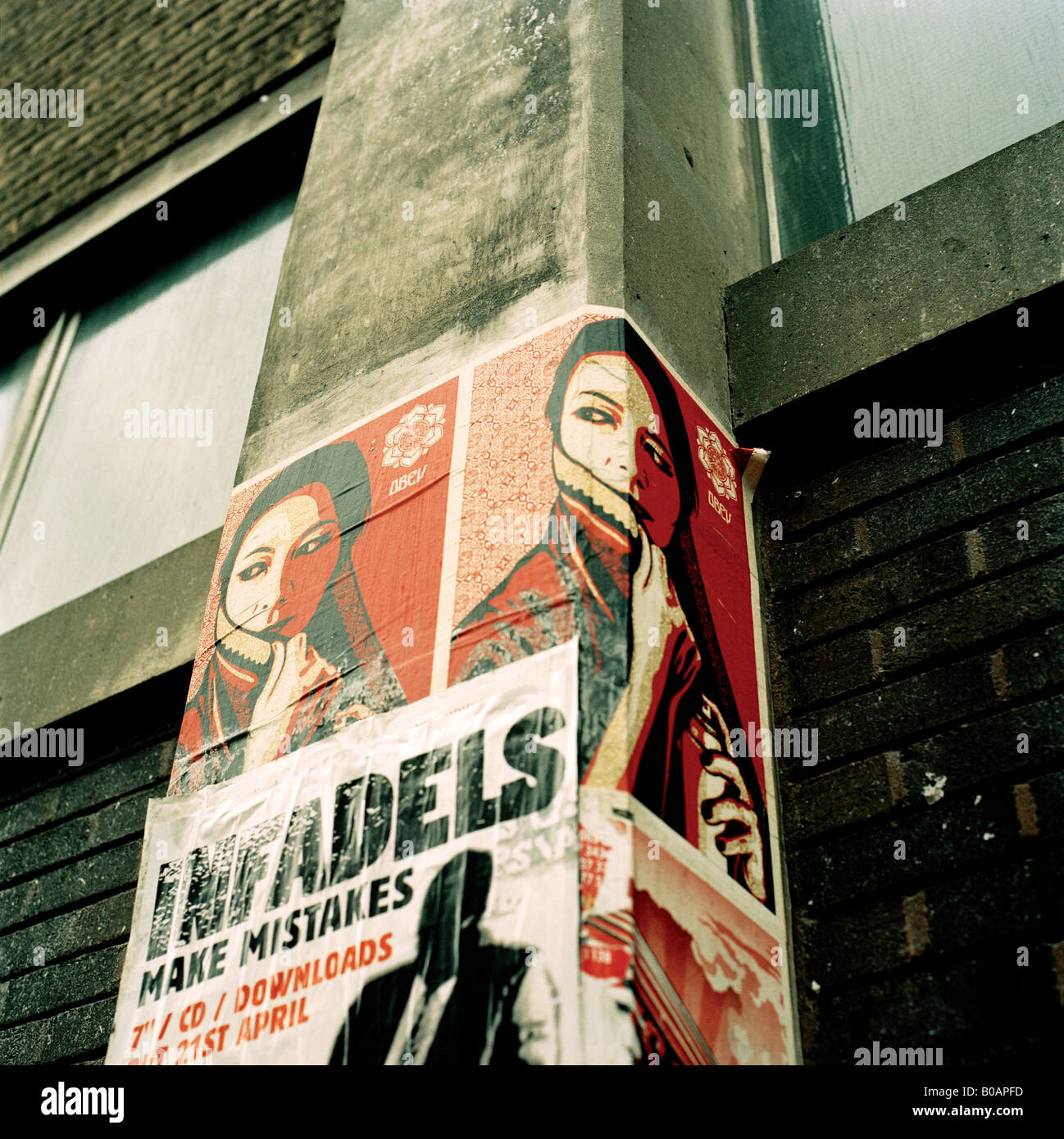 Fly posters by the American artist Shepard Fairey on Brick Lane in ...