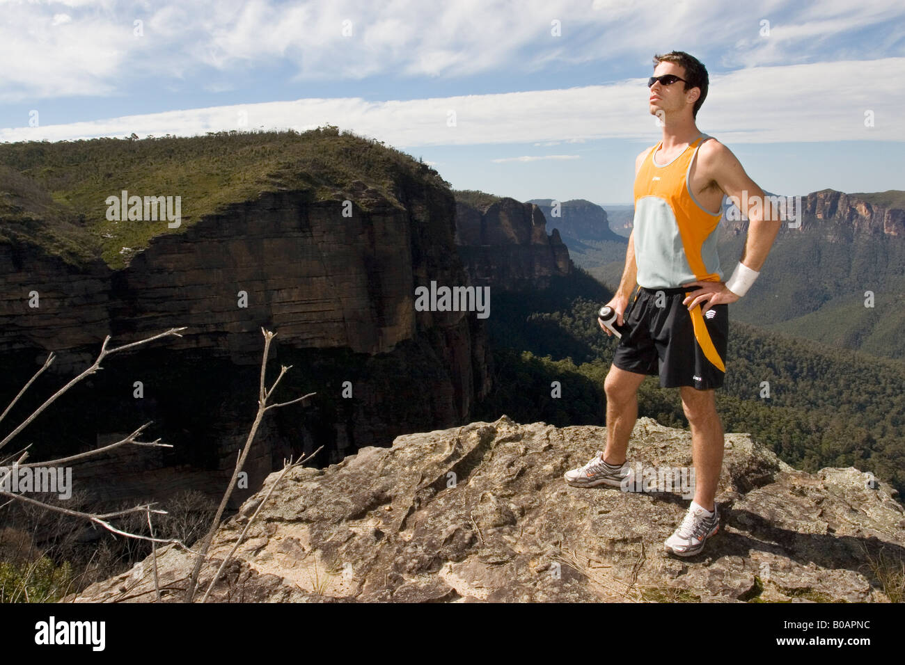 Male Runner on Cliff Top Stock Photo - Alamy