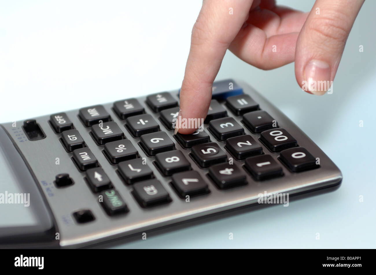 hand operating a calculator Stock Photo - Alamy