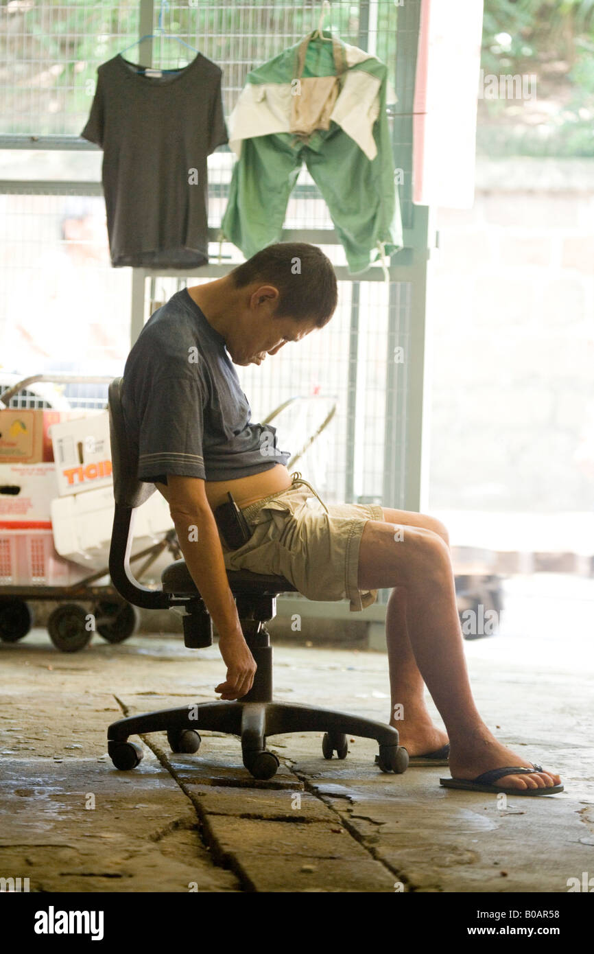 Man and slumped and chair hi-res stock photography and images - Alamy