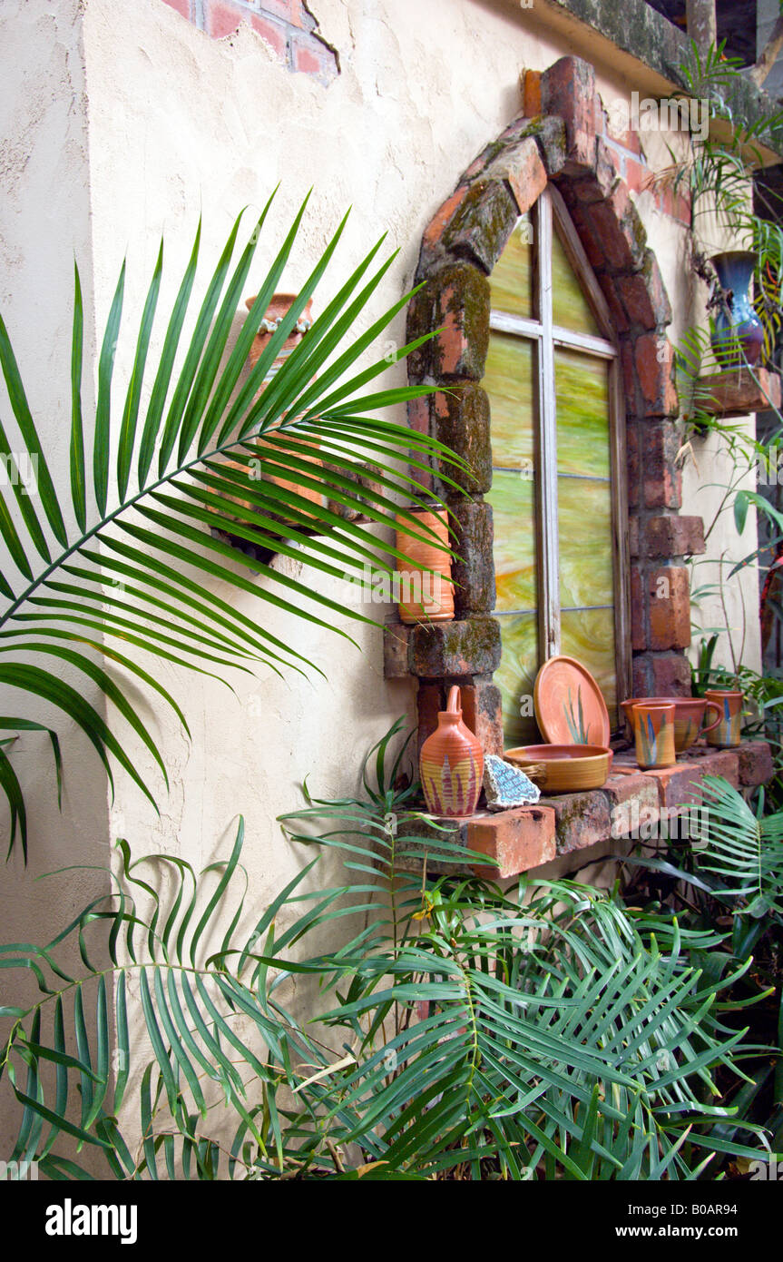 Decorative tropical foliage and a rustic window display in the Florida ...
