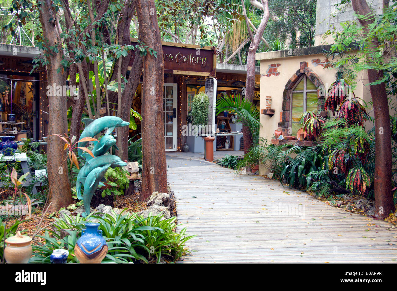 Decorative tropical foliage and a rustic window display at the Rain ...
