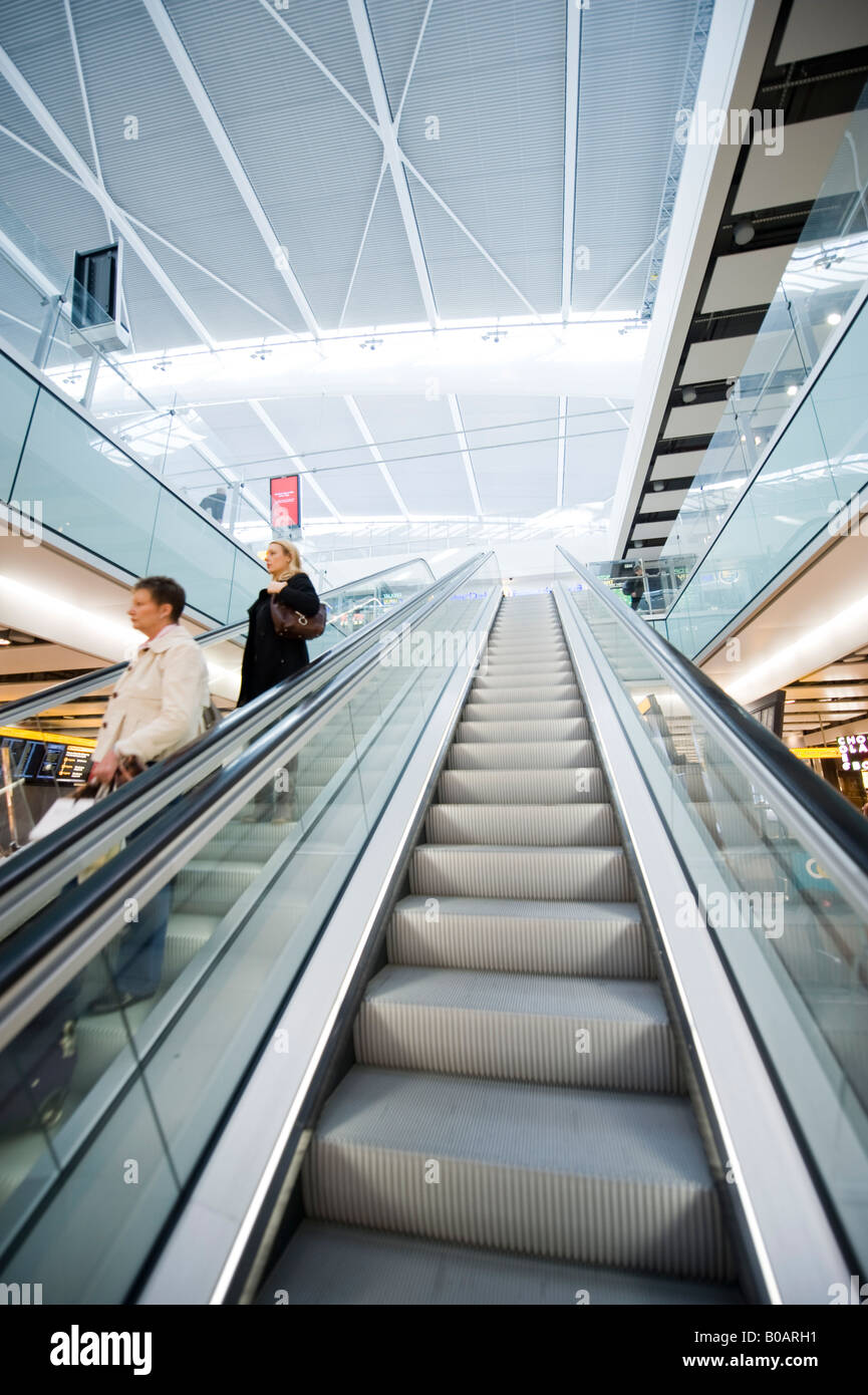 escalators at terminal five Heathrow airport London Stock Photo - Alamy