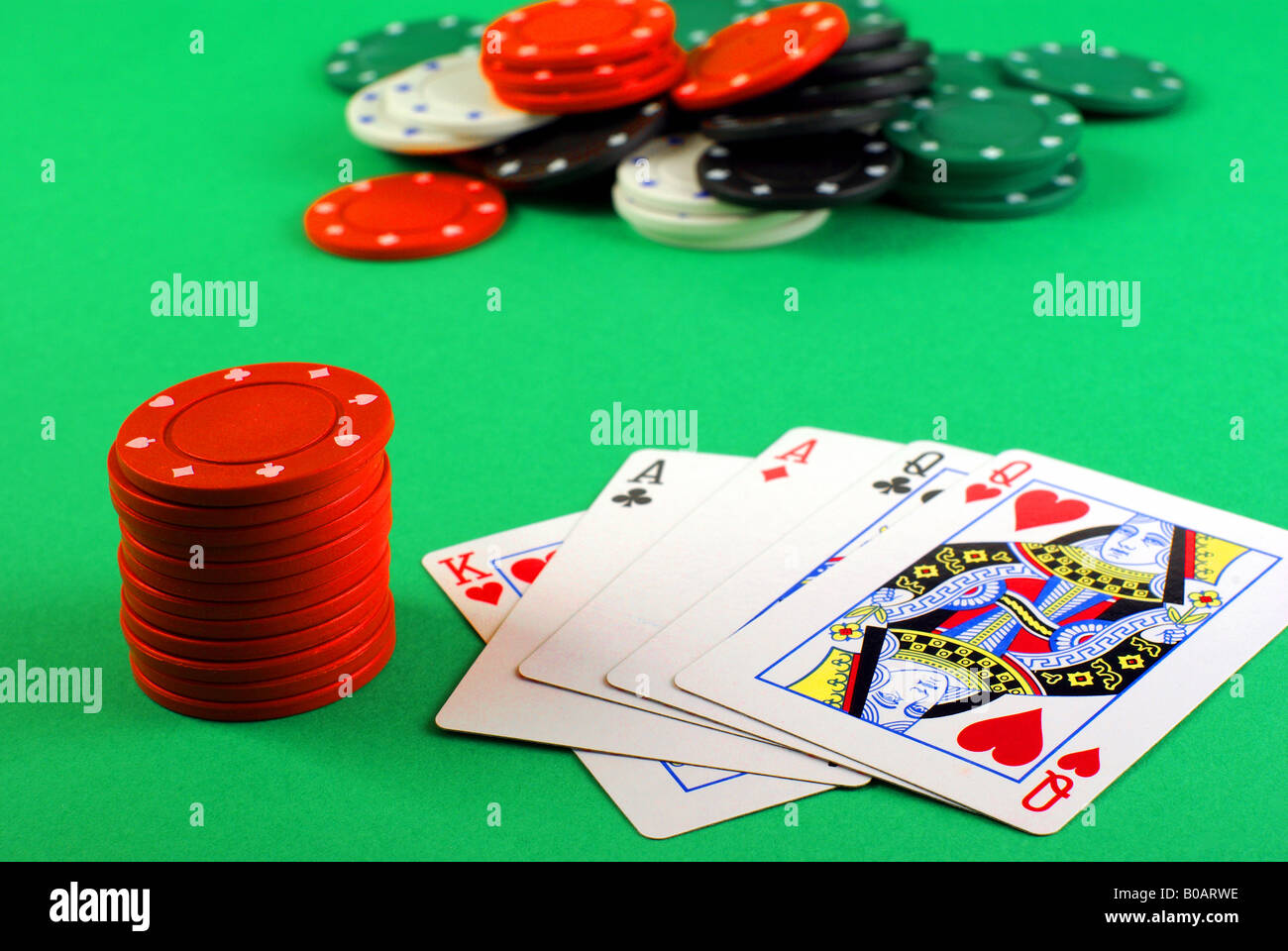 Poker hand with chips Stock Photo - Alamy