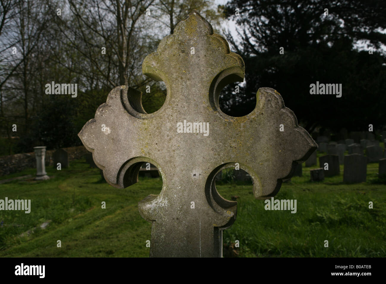a sinister photo of a grave stone with a shadowy background Stock Photo ...