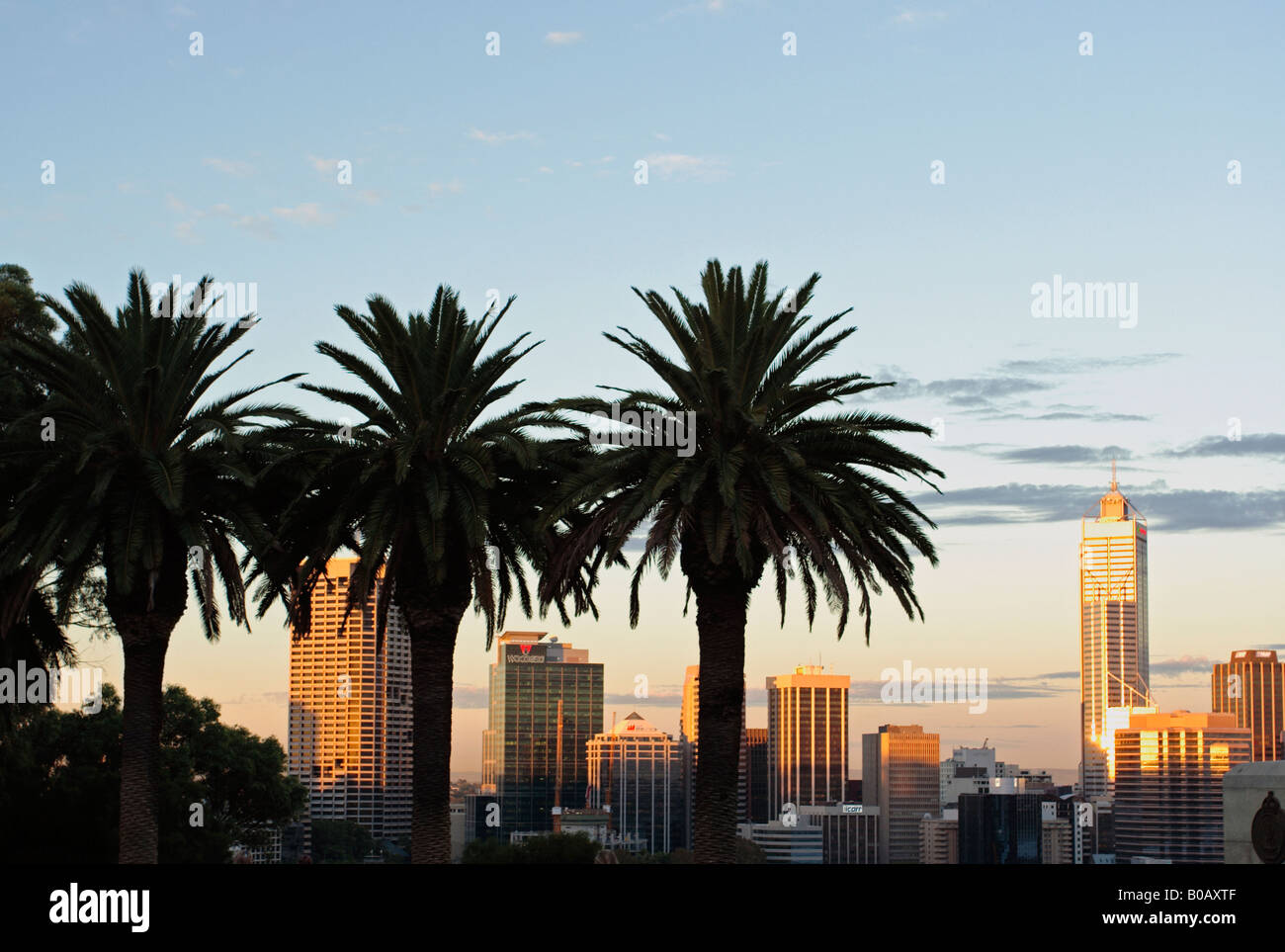 Setting sun lighting up the upper floors of high rise buildings in ...