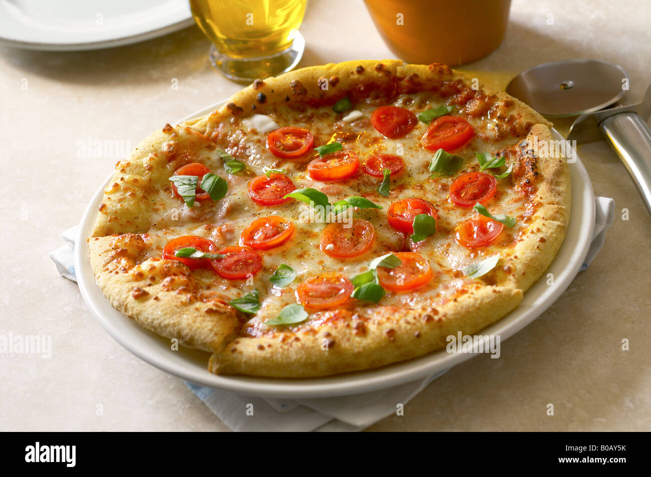 Margarita Pizza with torn basil leaves Stock Photo - Alamy