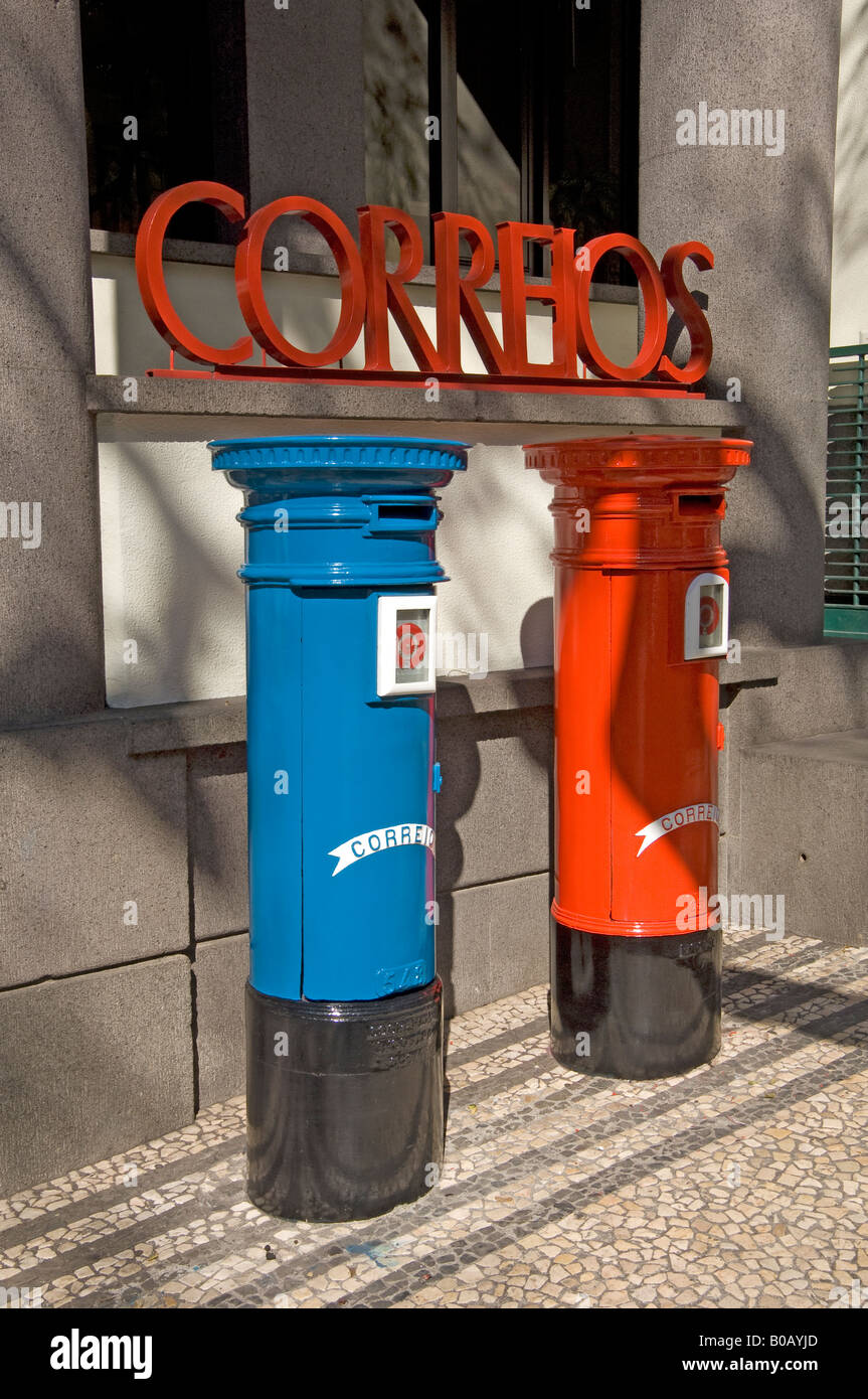 Red and blue post boxes outside post office in a street Funchal Madeira ...