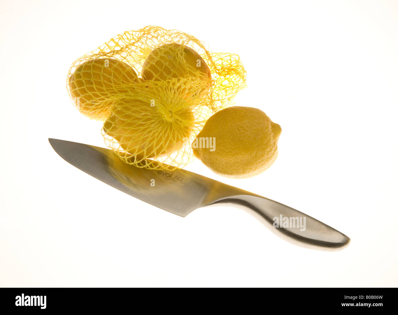 Knife slicing lemons hi-res stock photography and images - Alamy