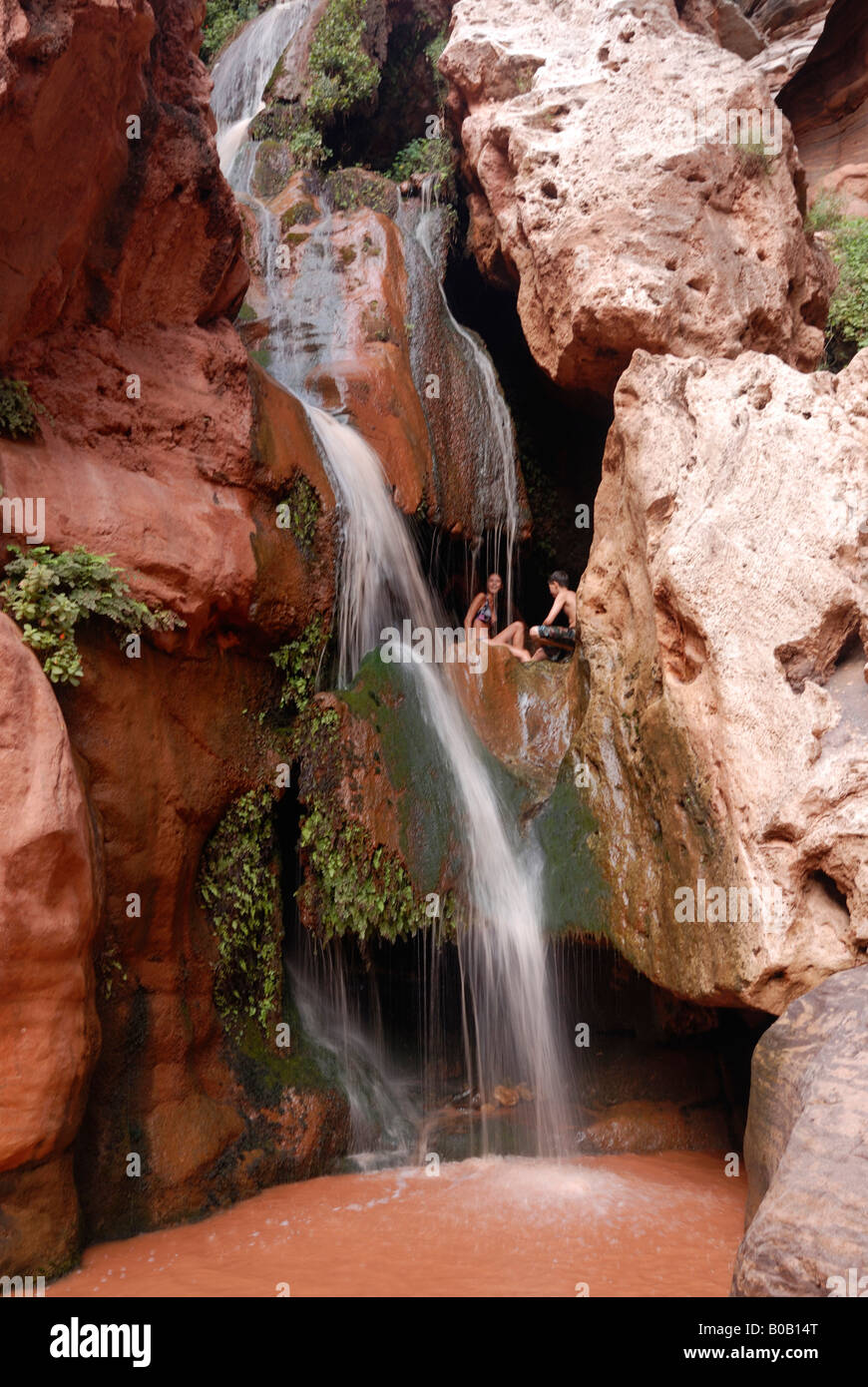 Tourist bathing in a waterfall Grand canyon seen while rafting down the ...