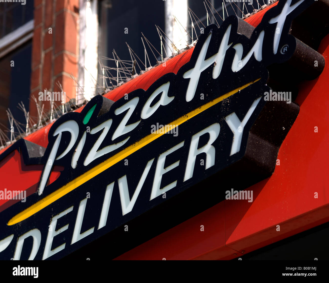 Pizza Hut Sign and Anti Bird Spikes Stock Photo - Alamy
