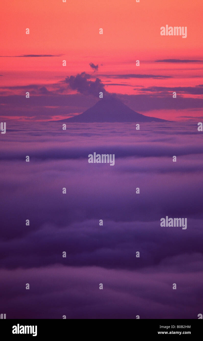 The Mt Augustine volcano releases steam during sunset as seen acrossed ...