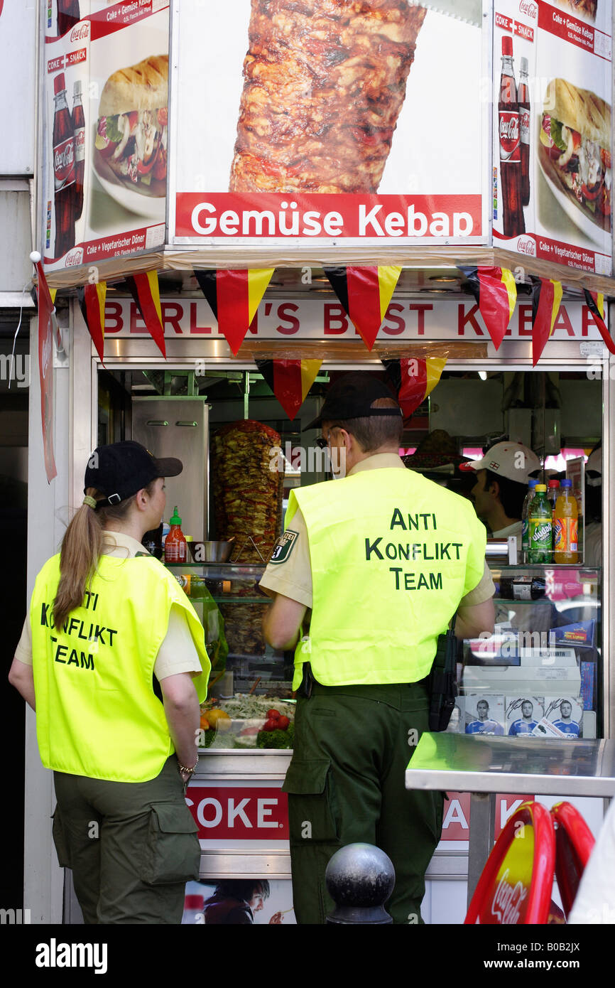 Police officers at a snack bar, Berlin, Germany Stock Photo - Alamy