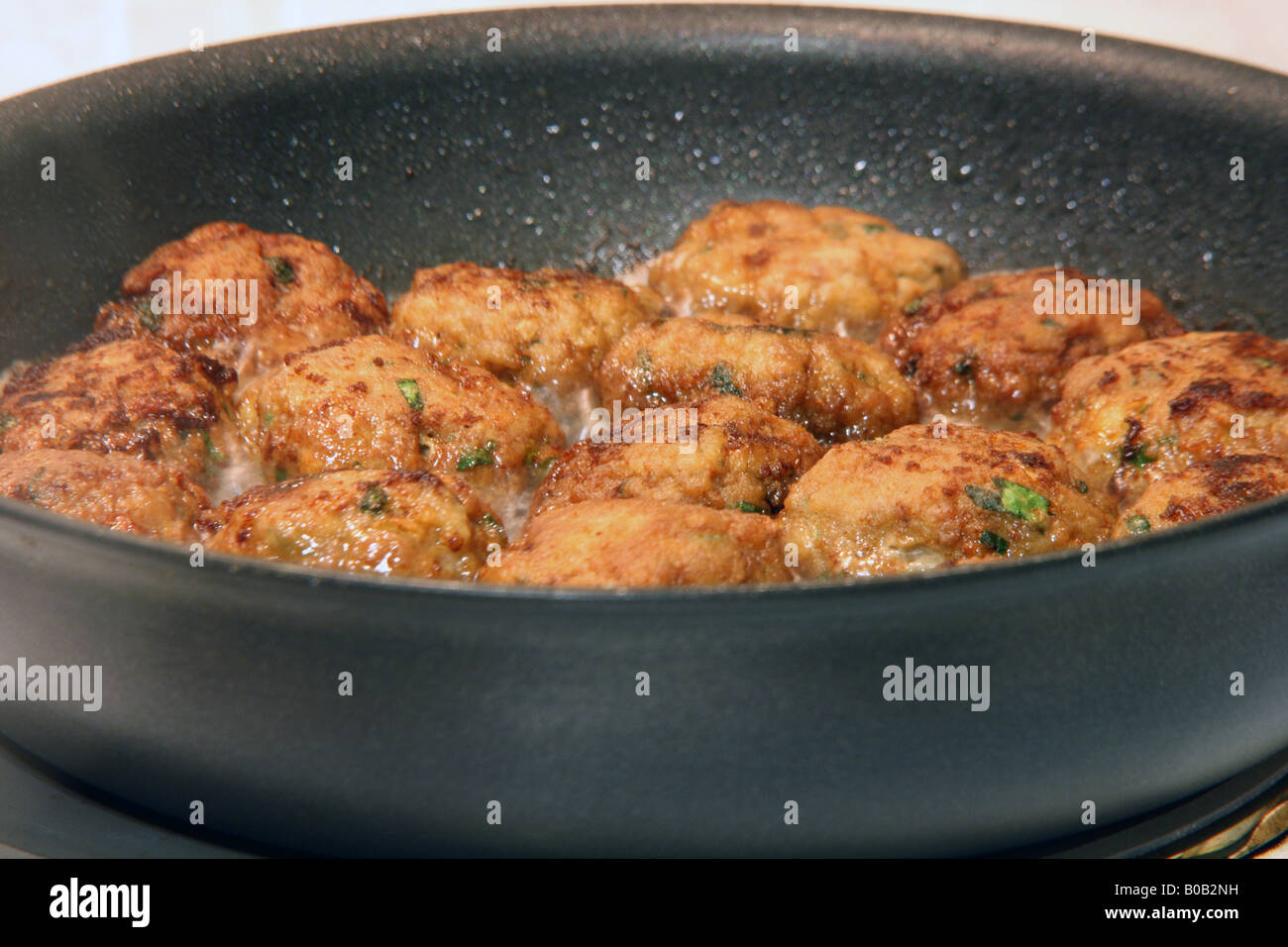 cooking meat balls in frying pan food concepts Stock Photo - Alamy