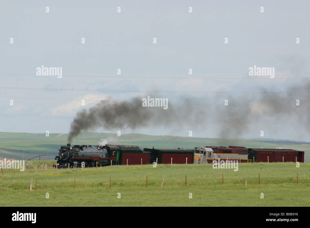 Steam train on a in praries on track, Canadian National Railway ...