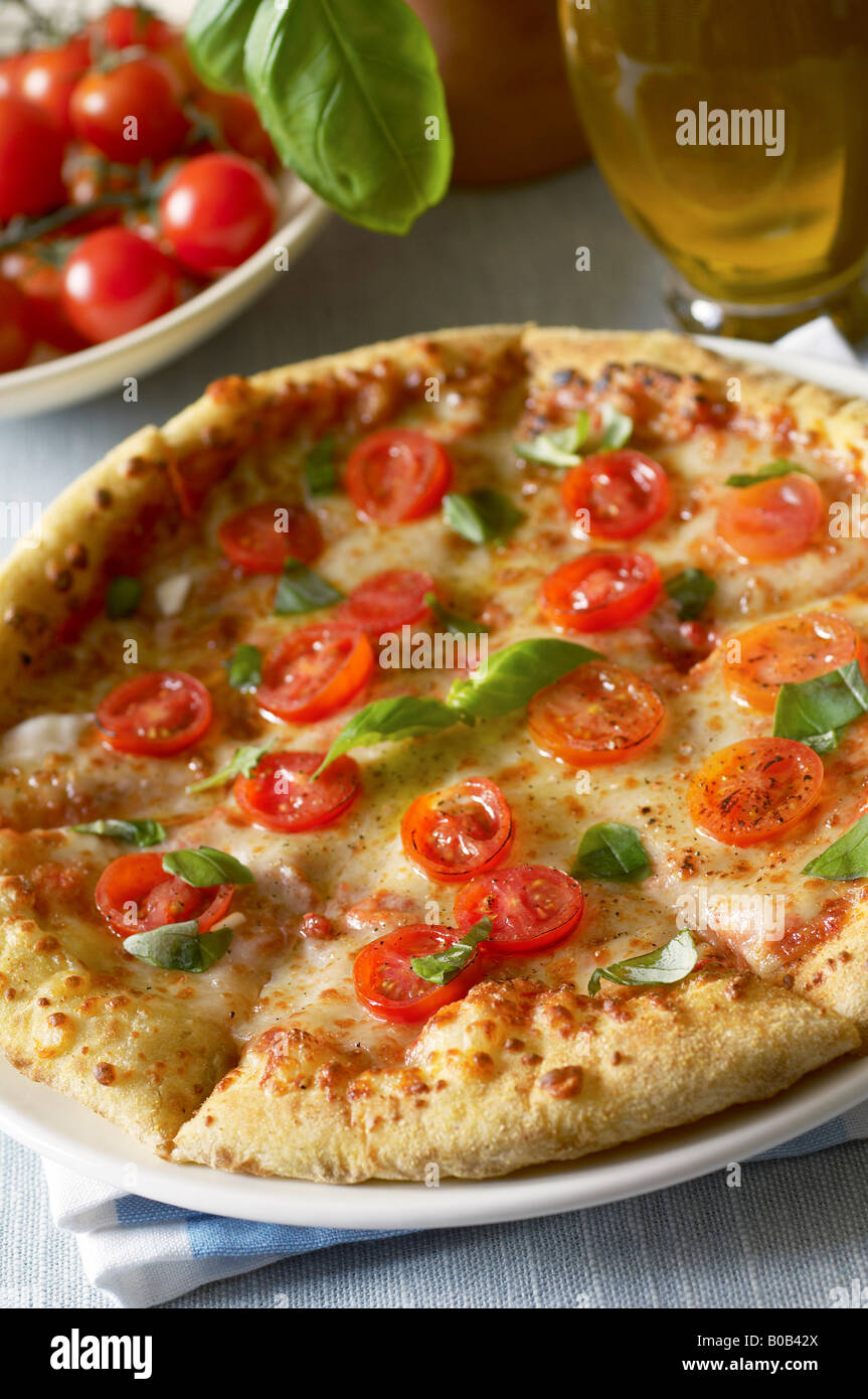 Margarita Pizza with torn basil leaves Stock Photo - Alamy