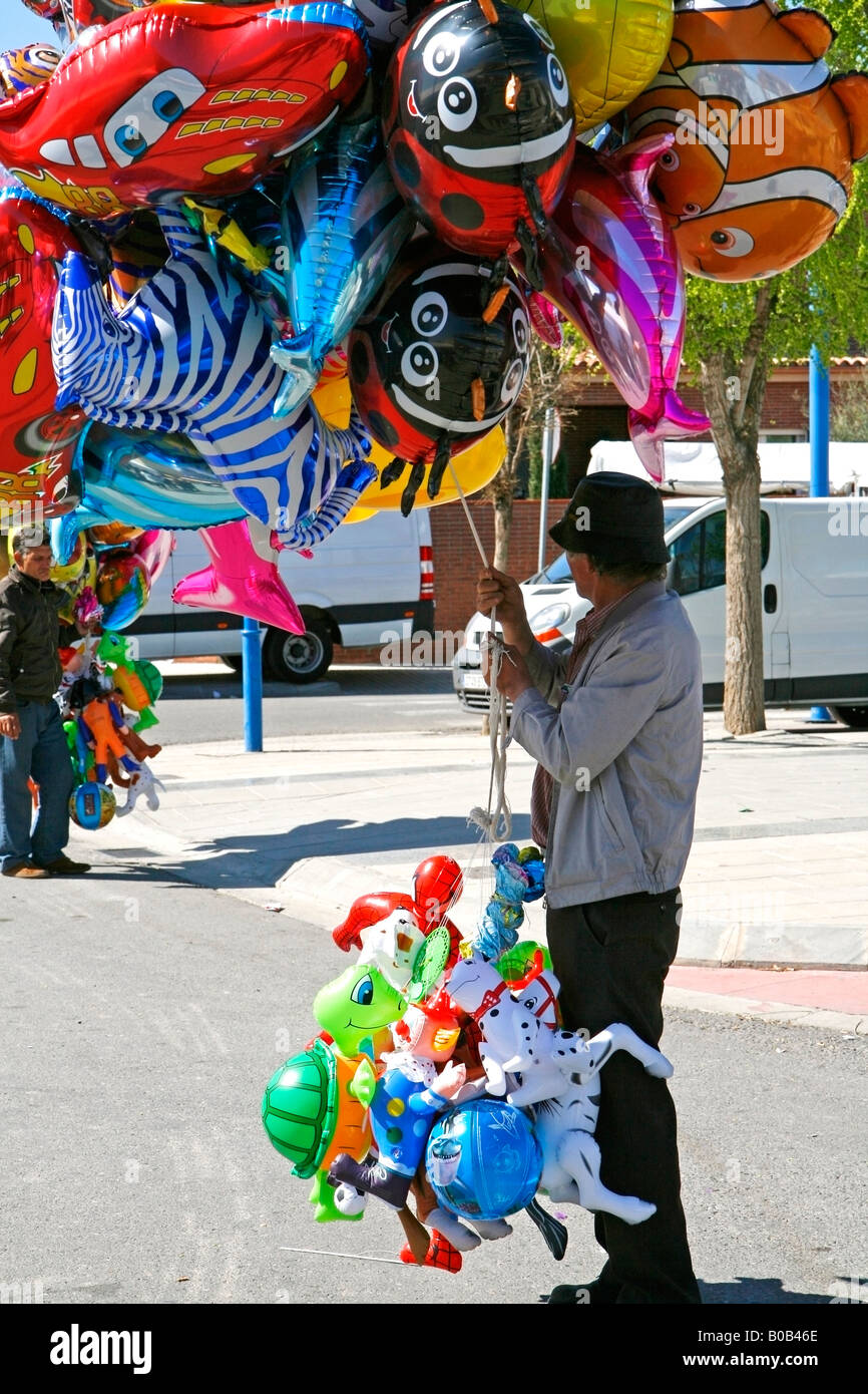 Balloon seller in a fair Stock Photo - Alamy