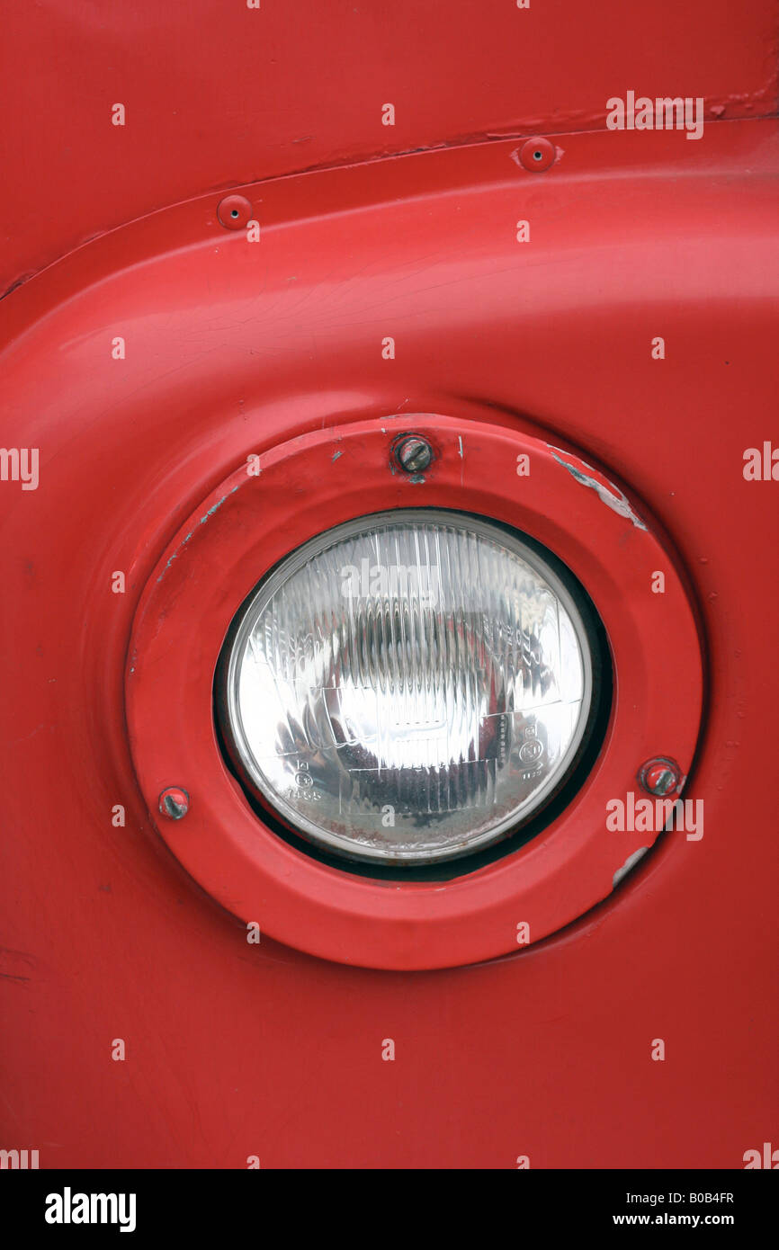 Routemaster red bus headlight Stock Photo - Alamy
