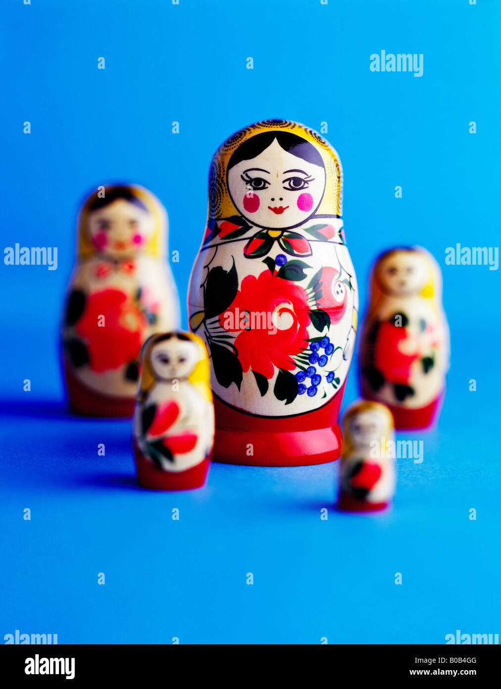 A group of wooden russian babushka dolls on a blue background Stock ...