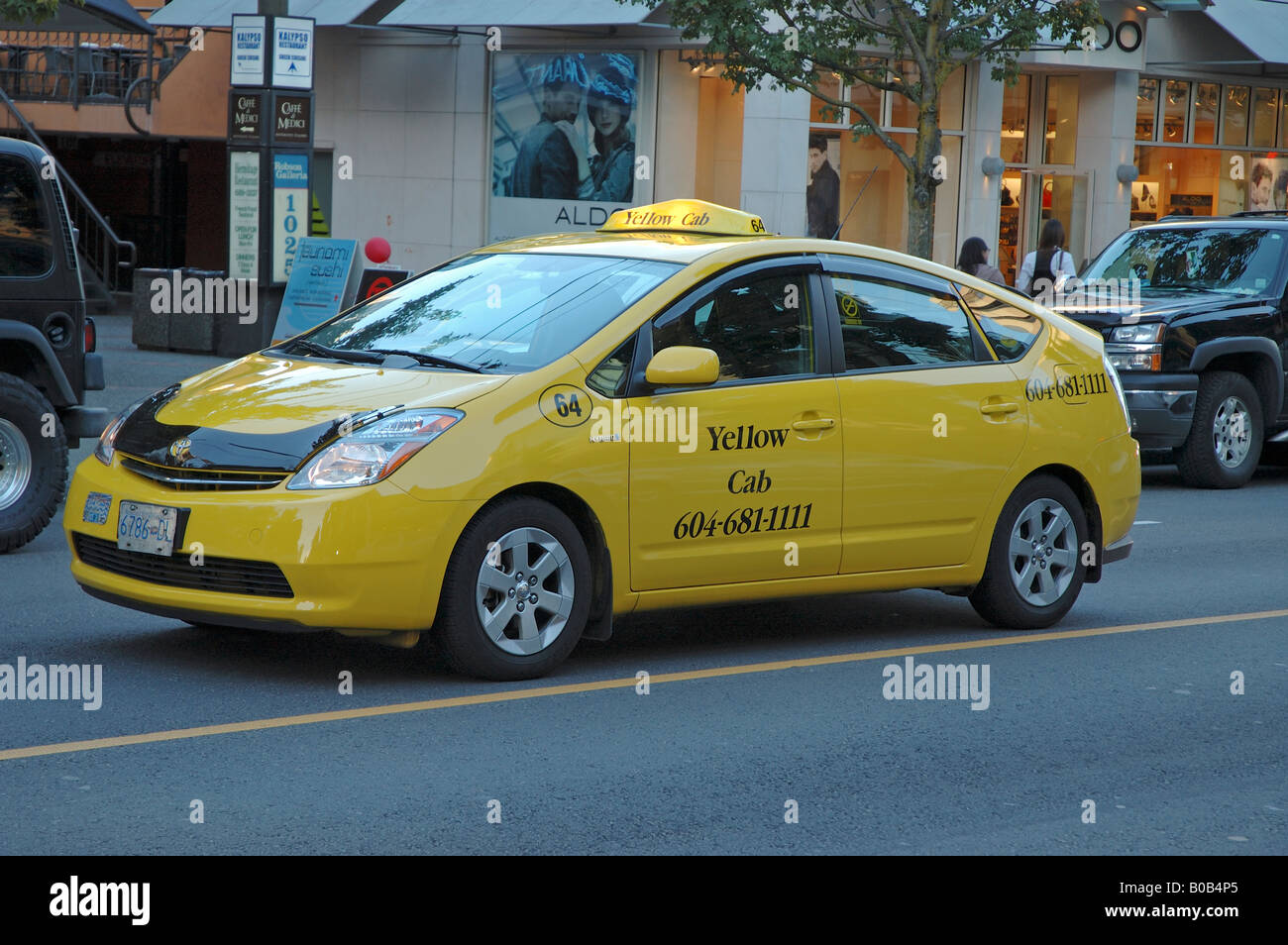 Vancouver city yellow taxi Stock Photo - Alamy