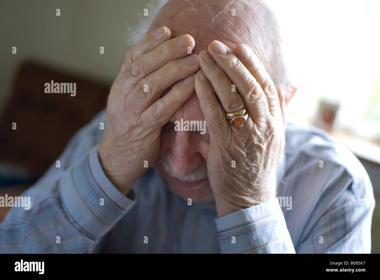 male pensioner in stressful situation Stock Photo - Alamy